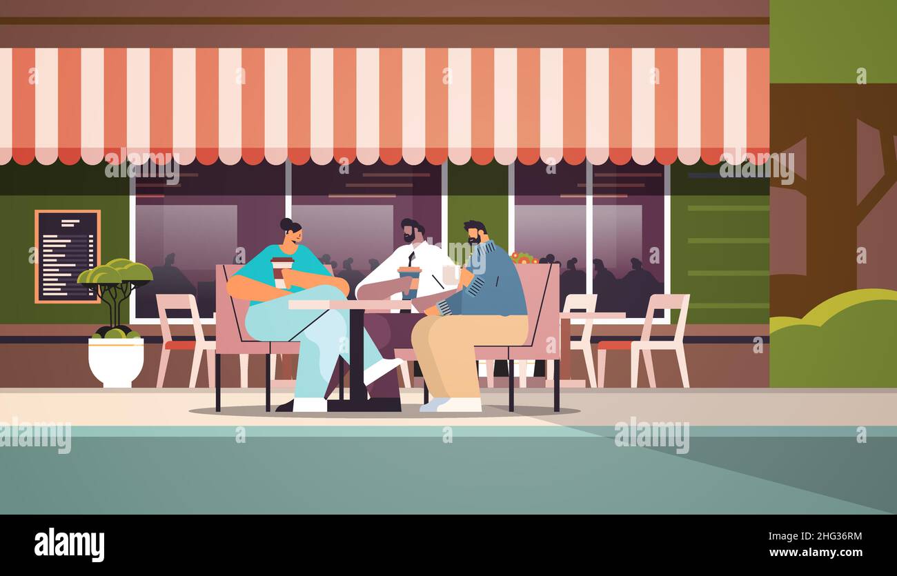 mix race businesspeople discussing during coffee break people holding ...