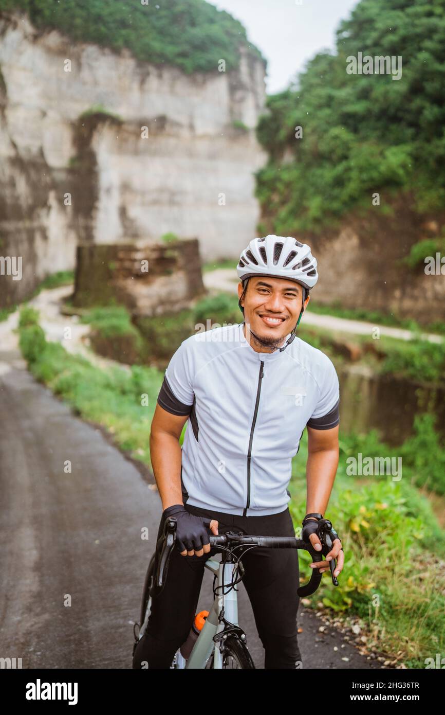 happy smiling road bike cyclist while riding his bike outdoor Stock ...