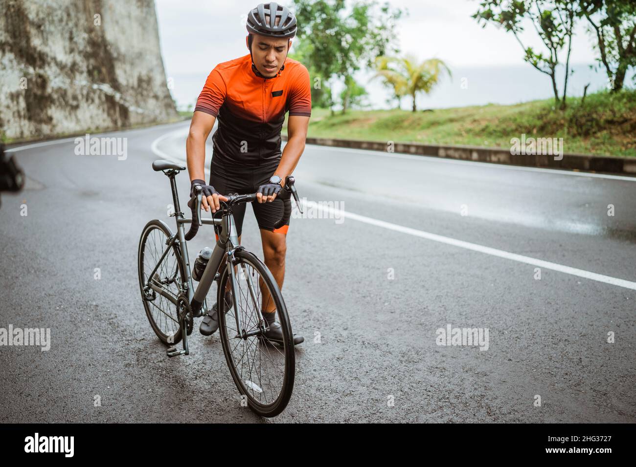 Pushing bike tired hi-res stock photography and images - Alamy