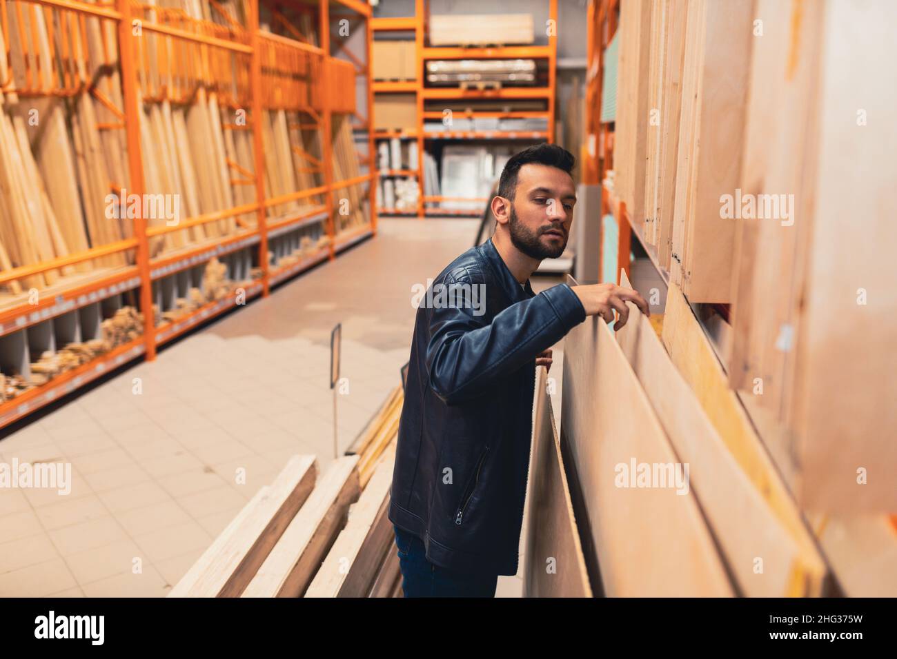 a buyer in a construction hypermarket in the lumber department chooses ...