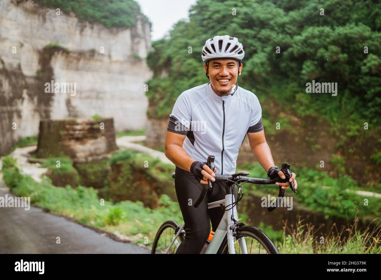 happy smiling road bike cyclist while riding his bike outdoor Stock ...