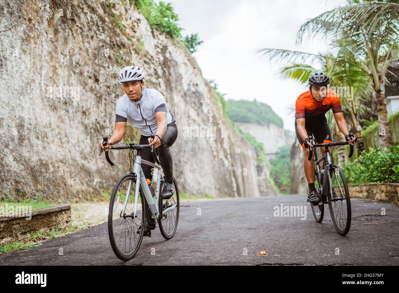 portrait of two asian male cyclist friend racing Stock Photo - Alamy