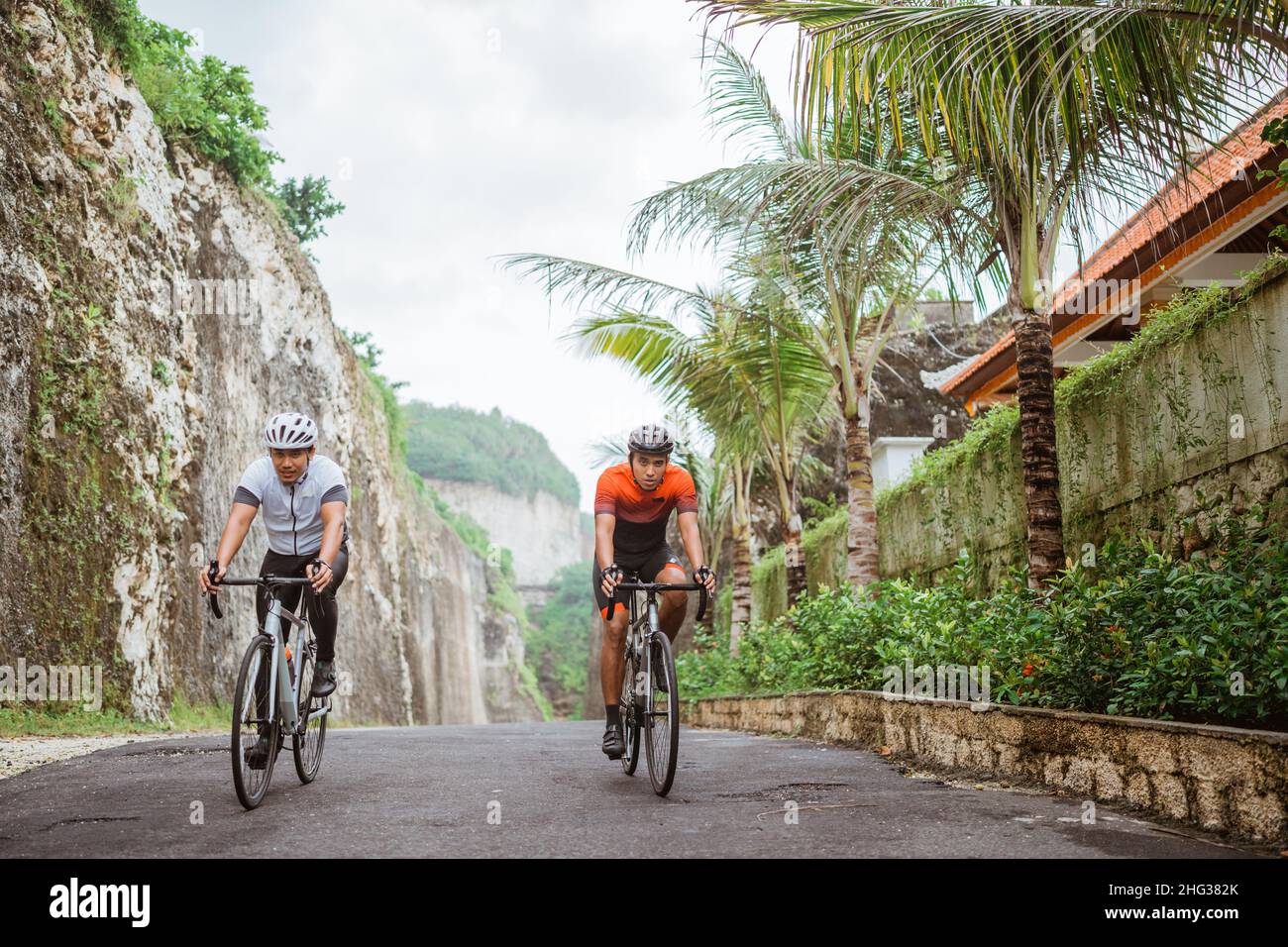 portrait of two asian male cyclist friend racing Stock Photo - Alamy