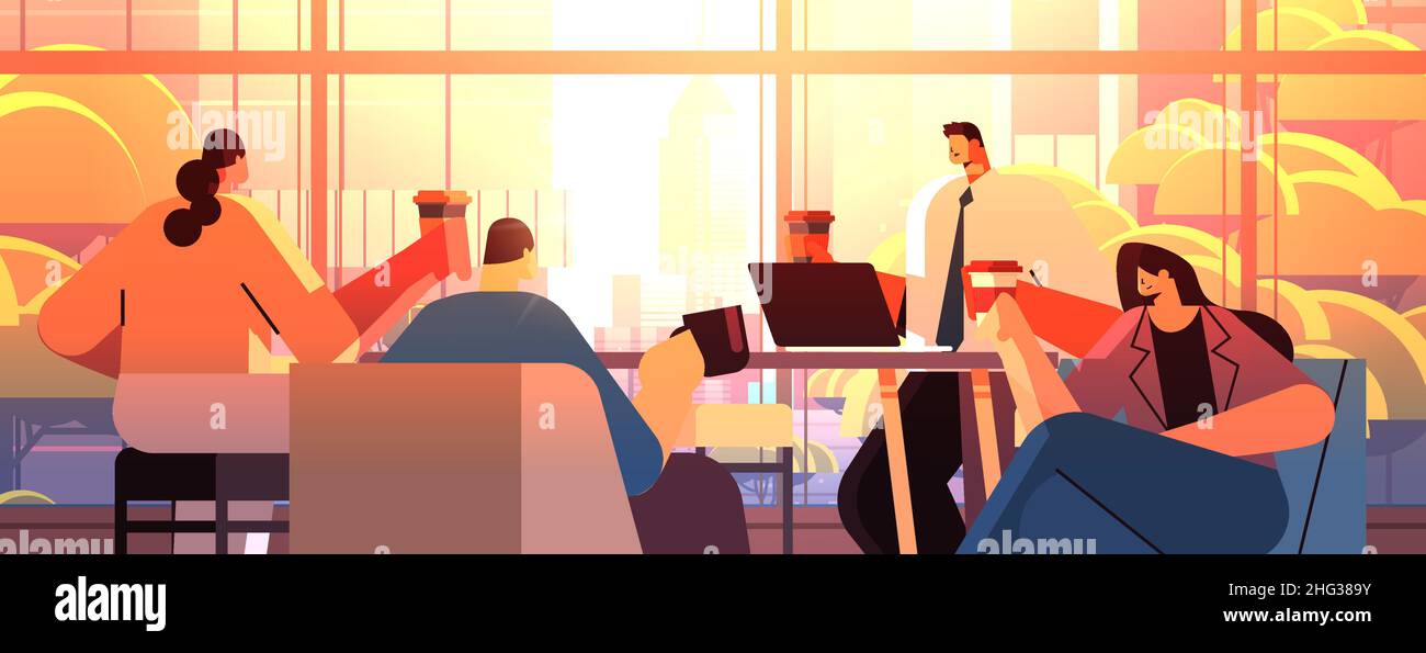 mix race businesspeople sitting at cafe table and drinking coffee ...