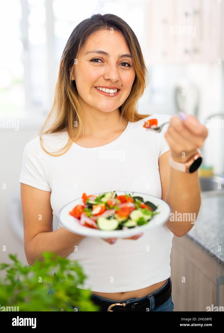 Female eating healthy salad with fresh vegetable Stock Photo - Alamy