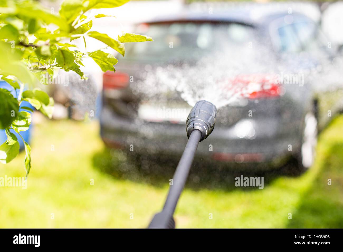 Car wash with modern car shampoo using a high pressure washer in summer ...