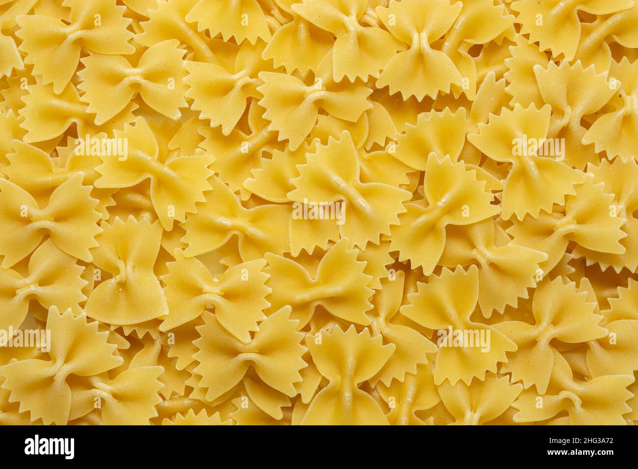 Farfalle. Appetizing raw pasta in the form of bows, butterflies ...