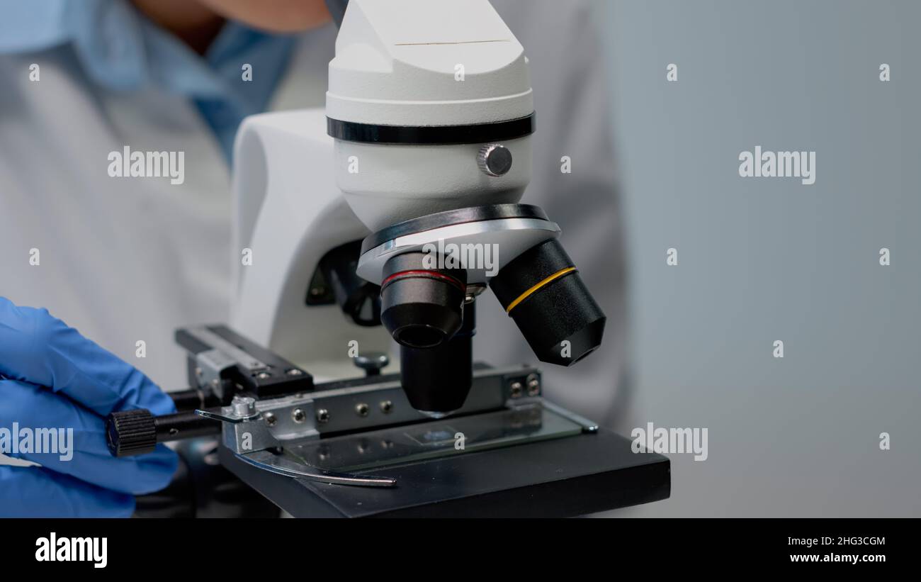 Sample tray of scientific microscope in laboratory used by doctor for ...