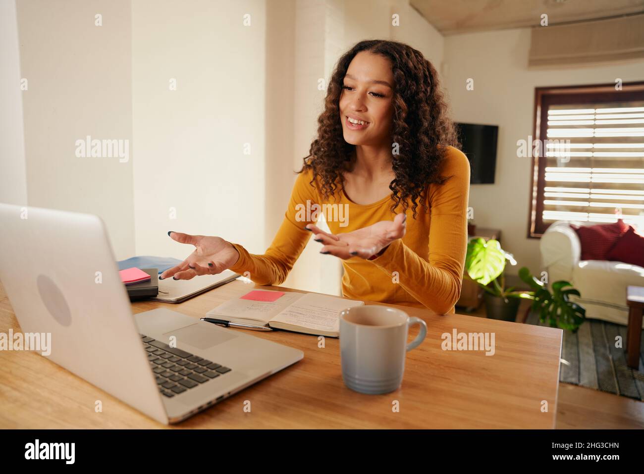 African American female business woman working from home speaking to ...