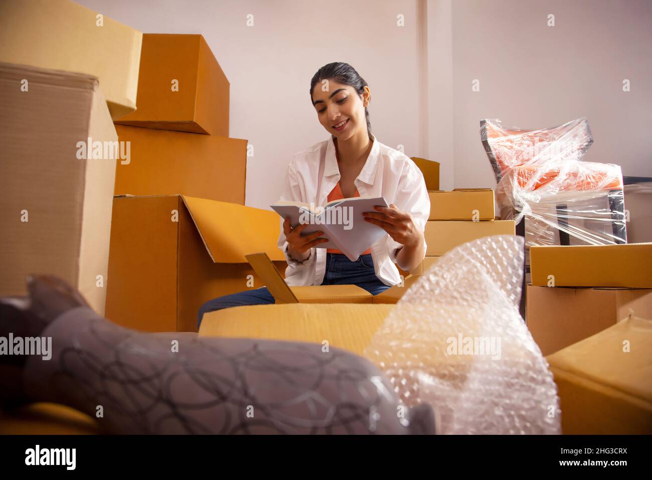 Girl Packing Books High Resolution Stock Photography and Images - Alamy