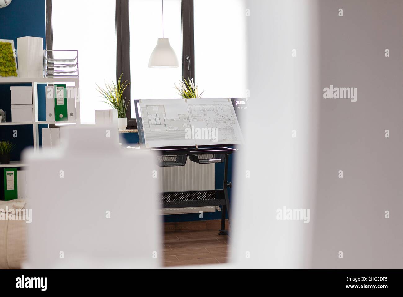 Stand with drawing plans for real estate development in modern ...