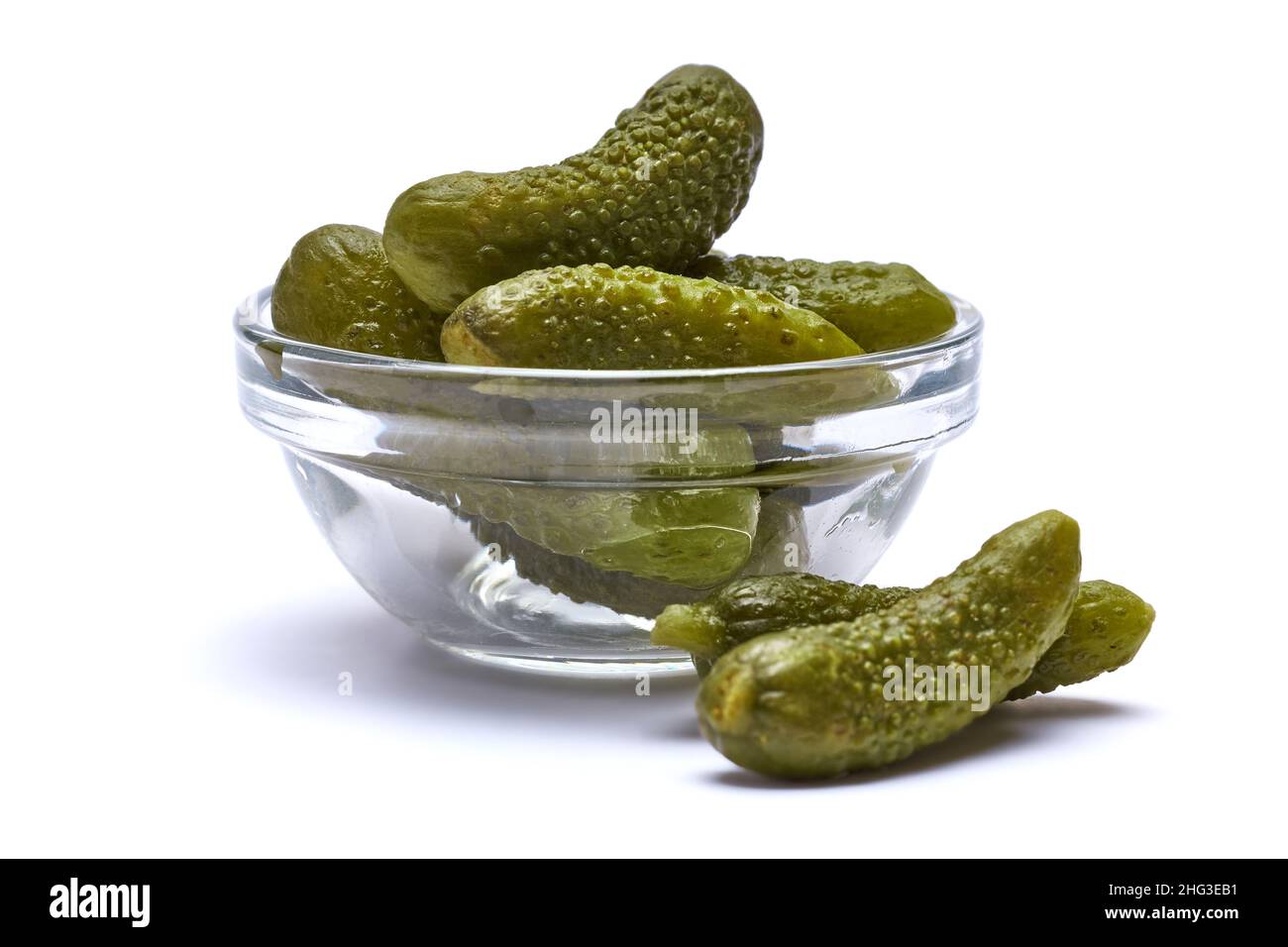 Bowl of Tasty canned Whole green cornichons isolated on a white ...