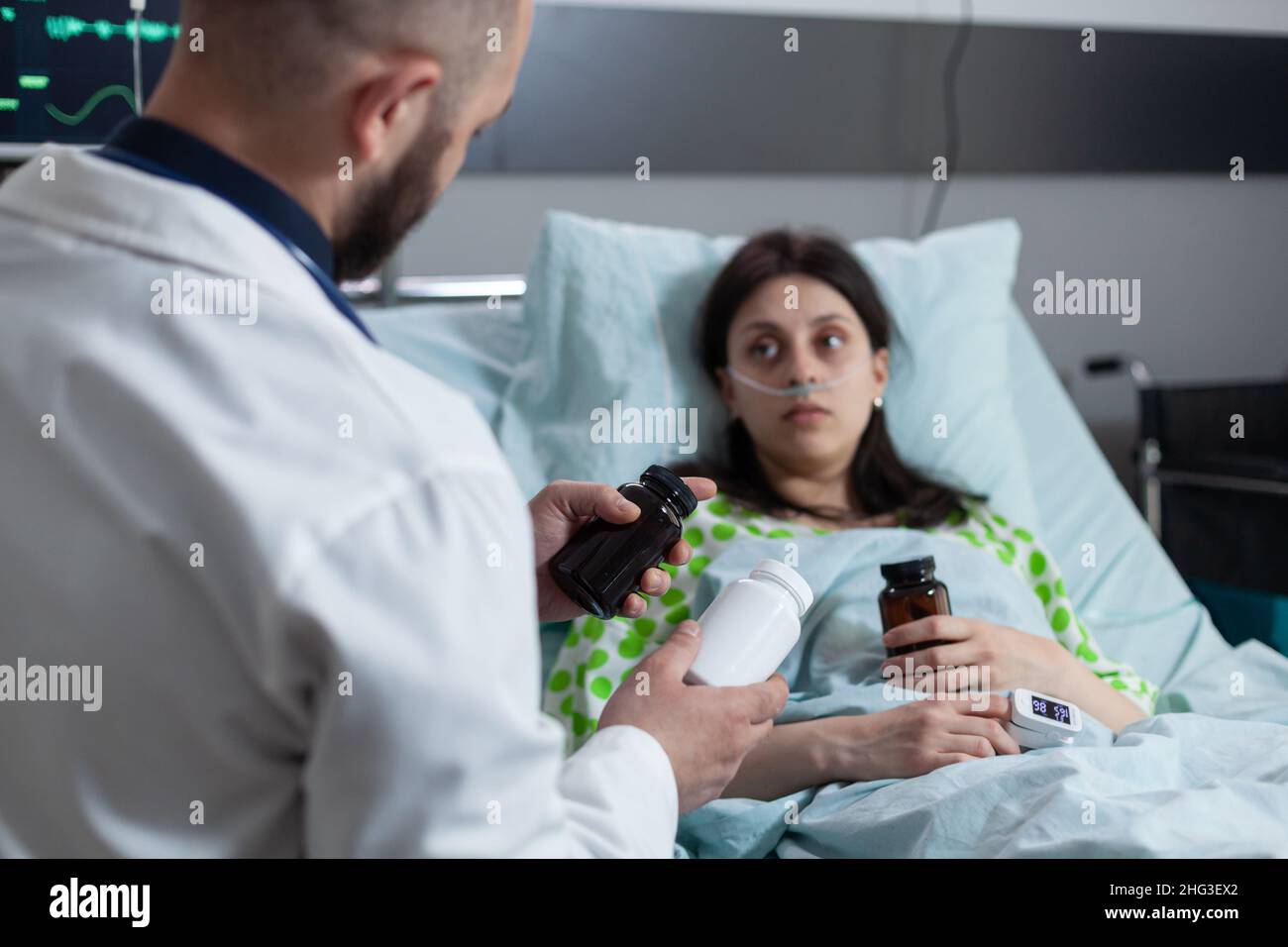 Woman feeling ill admitted into clinic recieving choice of prescription ...