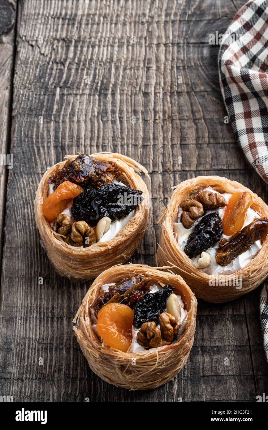 Traditional arabic and turkish sweets pastry dessert kadaif with nuts ...