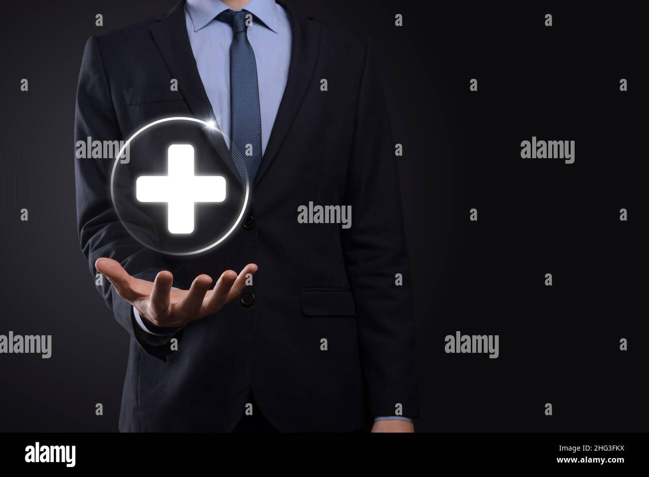 Businessman hold virtual plus medical network connection icons. Covid ...