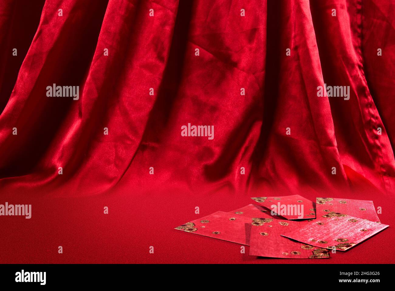 Stack of red envelopes (Angpao) with a red curtain background Stock ...