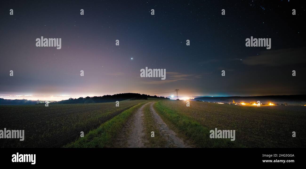 Night landscape field and dirt road, starry sky Stock Photo - Alamy