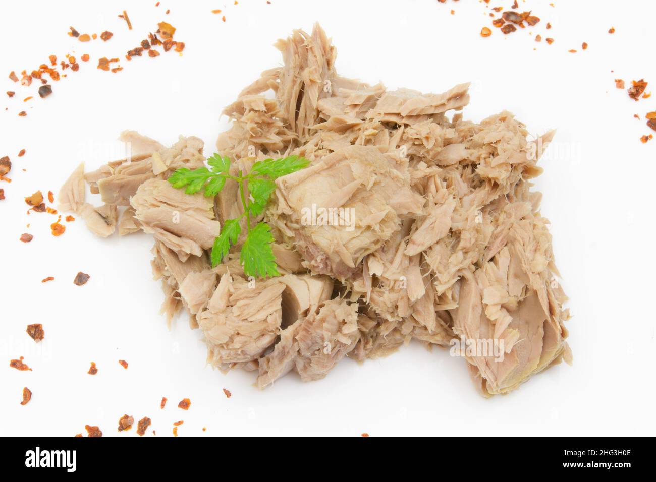 tuna crumb on white background with parsley Stock Photo - Alamy