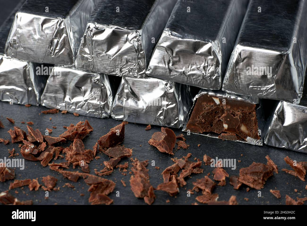 Stack of broken chocolate bars hi-res stock photography and images - Alamy