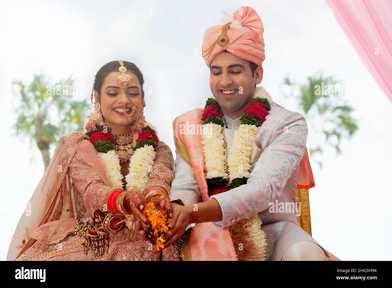 Indian bride and groom performing ritual during wedding ceremony Stock ...