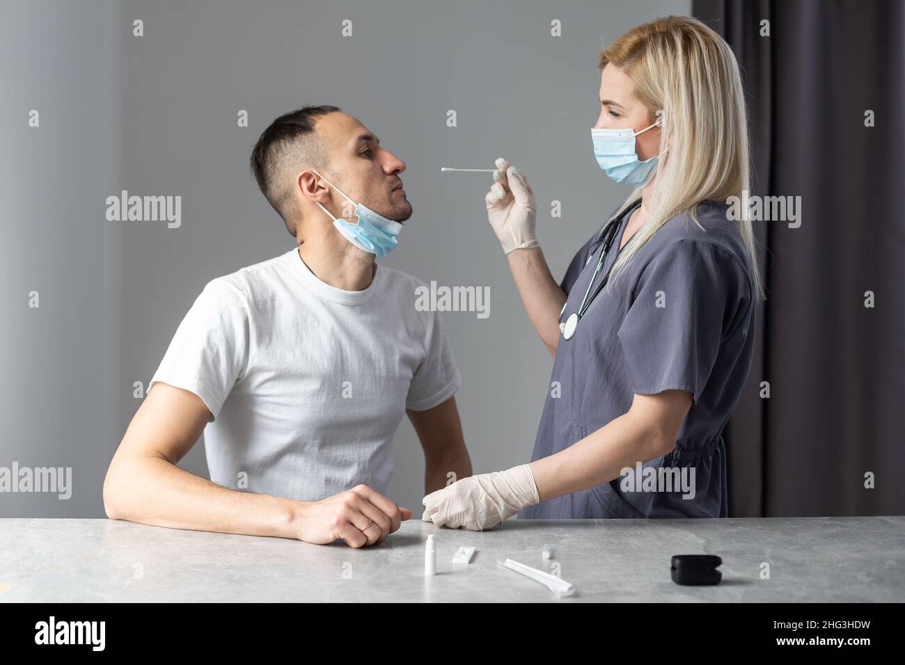 Getting Covid-19 Sample from nose. Doing Coronavirus Test to an Young ...