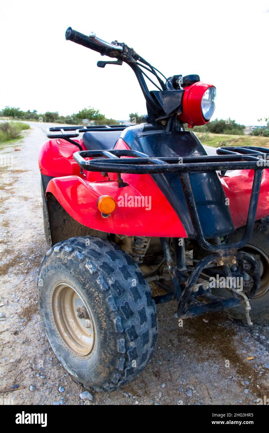 red quad in a field Stock Photo - Alamy
