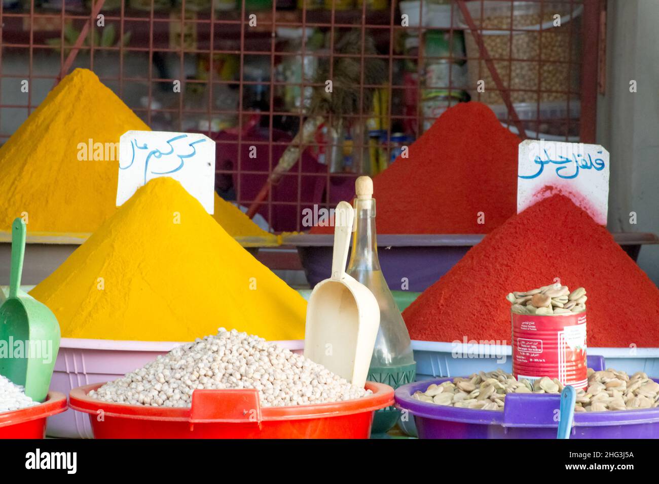 stall of different spices in dishes in an outdoor market Stock Photo ...