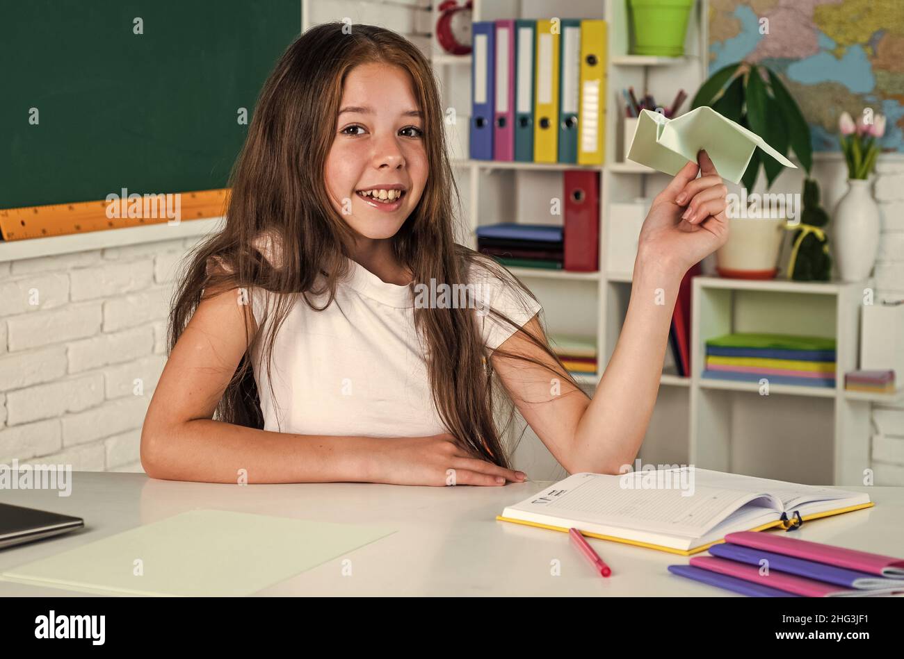 happy child in classroom school with blackboard, education Stock Photo ...