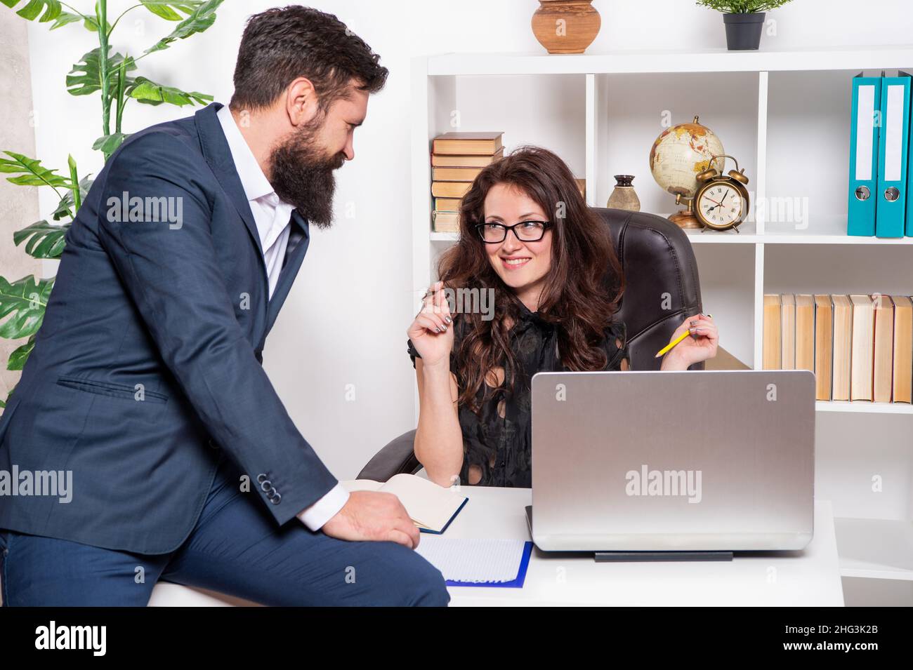 Happy professional woman flirting with man colleague in office, flirt ...