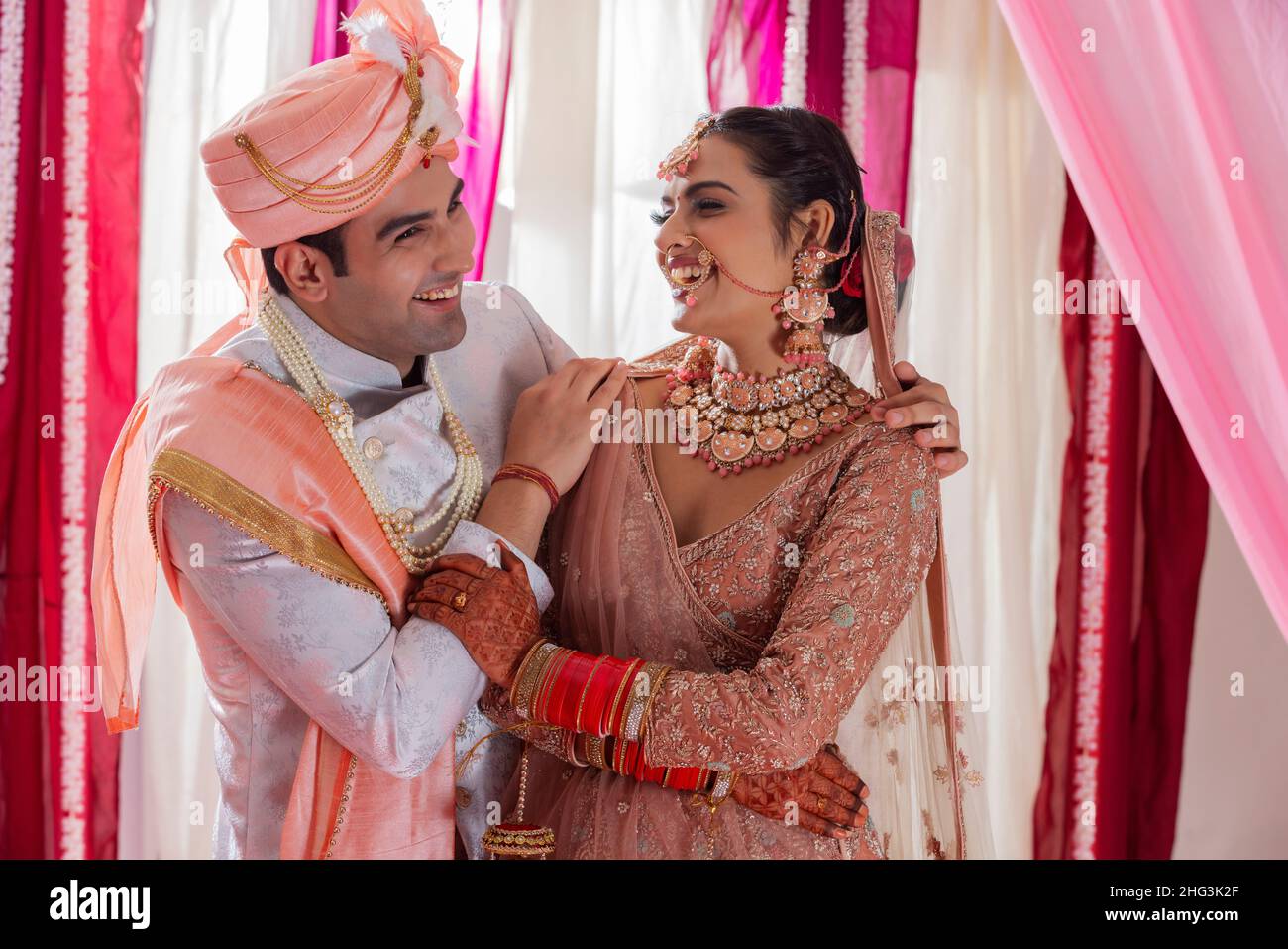 Happy wedding couple smiling together during wedding ceremony Stock ...