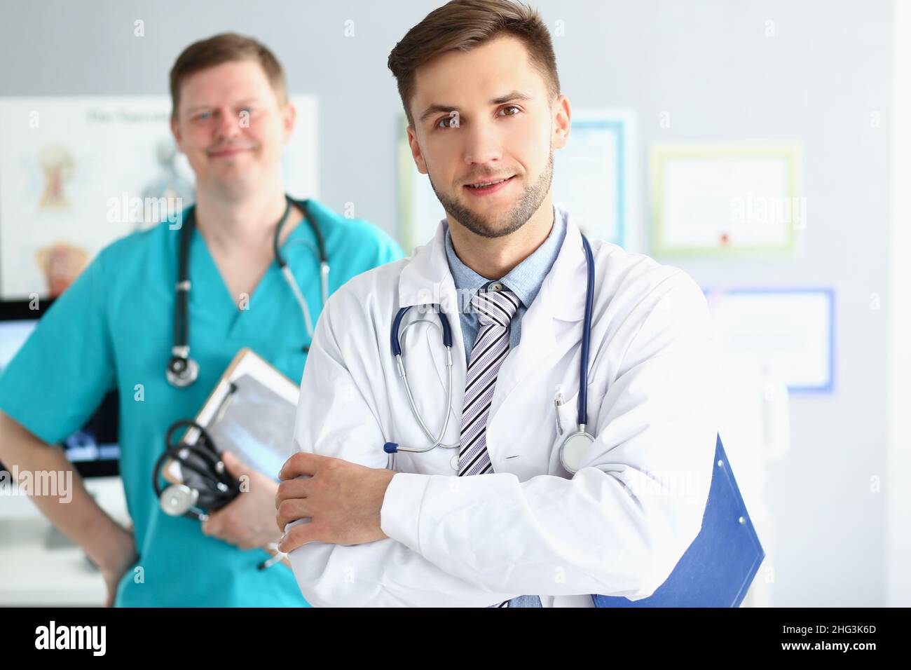 Medical male workers in uniform with stethoscopes, medical help ...