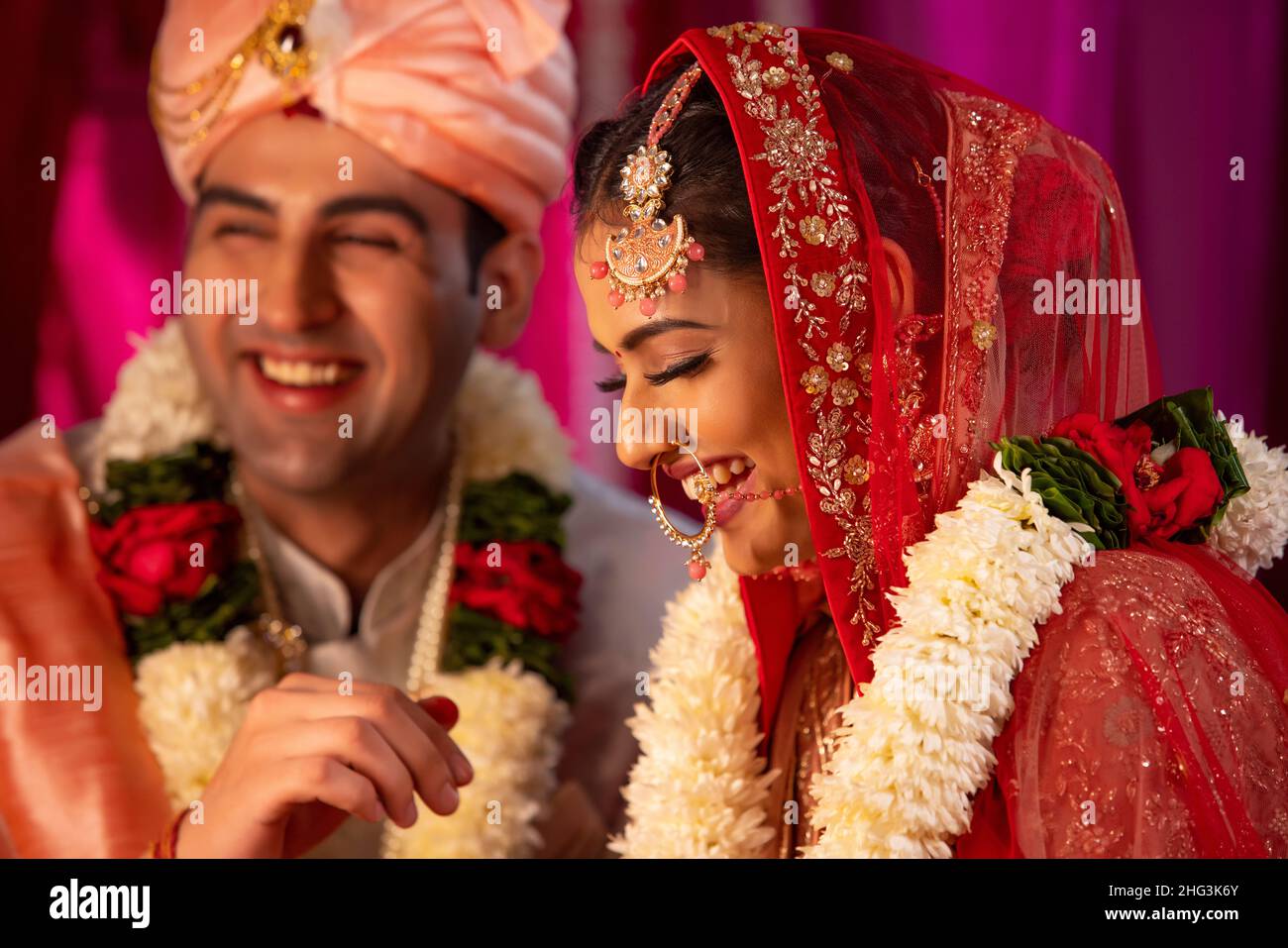 Indian groom putting sindoor on brides forehead during wedding ceremony ...
