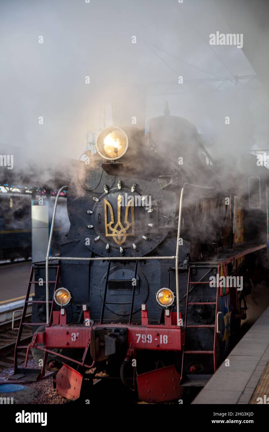 Ukraine, Kyiv - January 7, 2022: Retro train smokes on the platform of ...