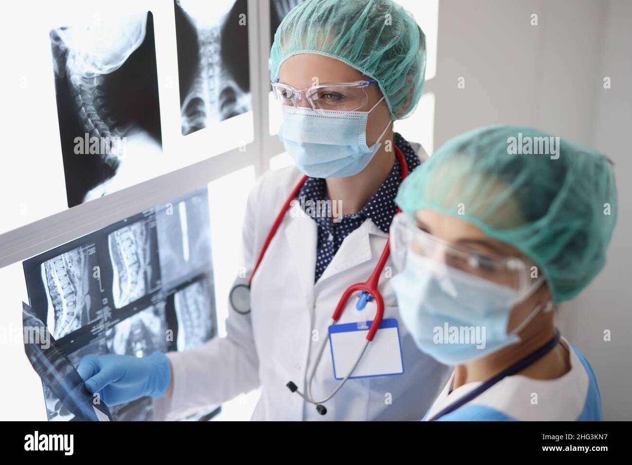 Women professional doctors look through x ray scans in hospital ...