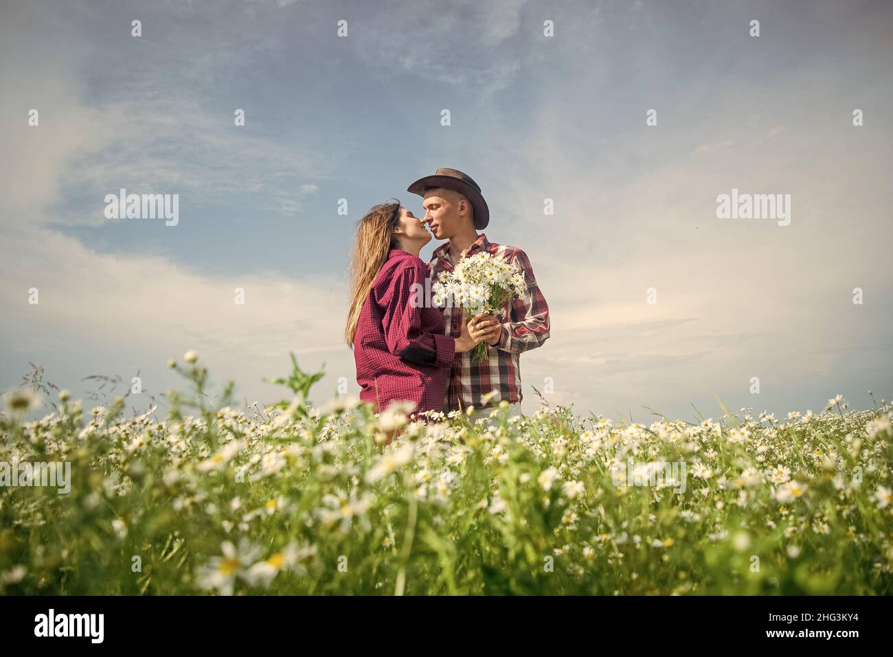 Sunshine portrait of happy couple outdoor in nature location at sunset ...