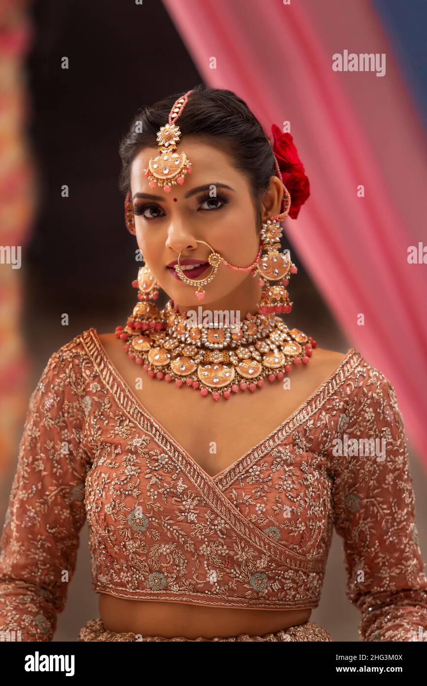 Portrait of a beautiful bride in traditional wedding outfit Stock Photo ...