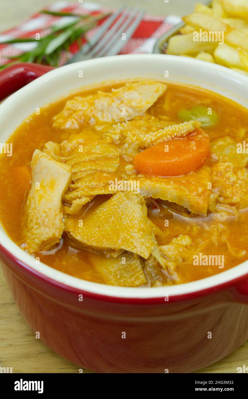 cooked tripe in a dish on a wooden table Stock Photo - Alamy