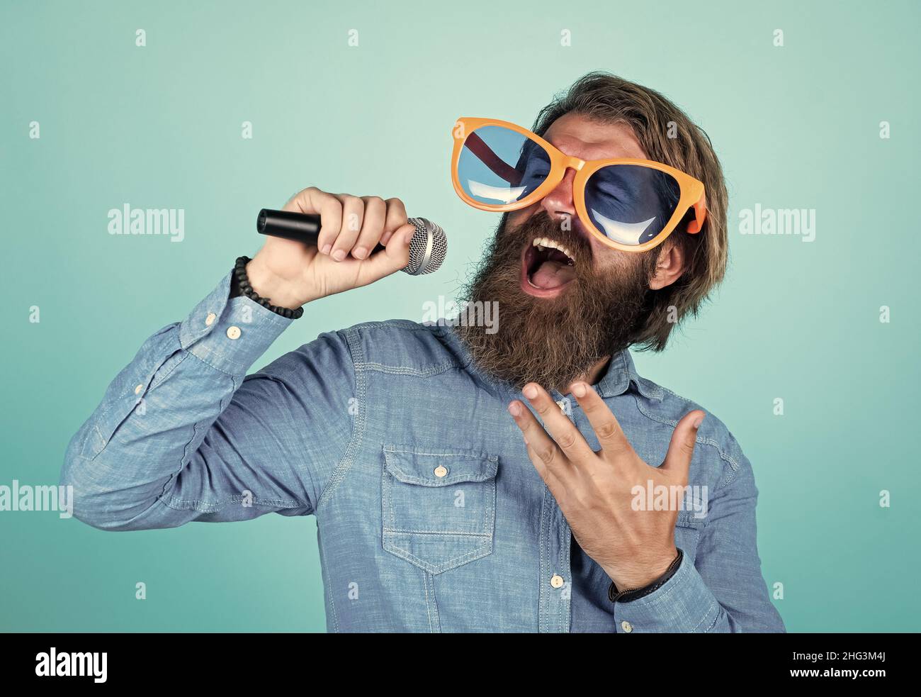 love is the music. male singer singing song in microphone. celebrate ...