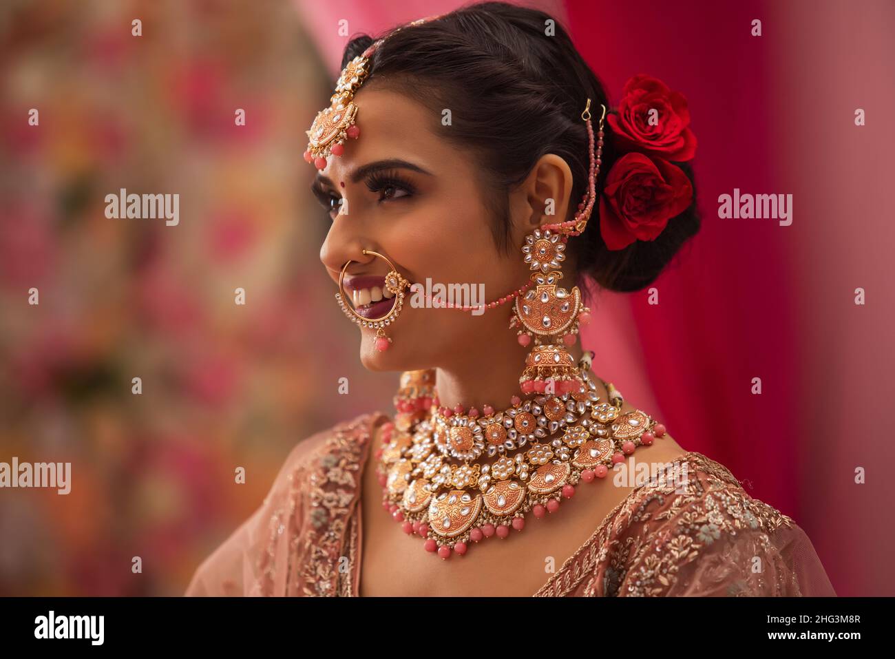 Portrait of beautiful smiling Indian bride in traditional wedding ...