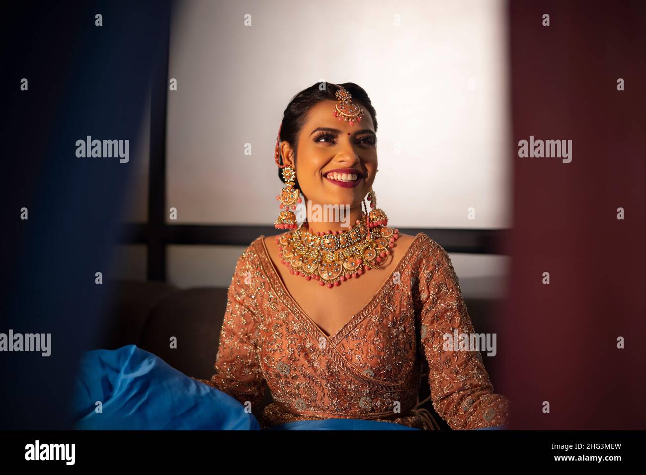 Beautiful Indian bride in traditional wedding outfit smiling Stock ...