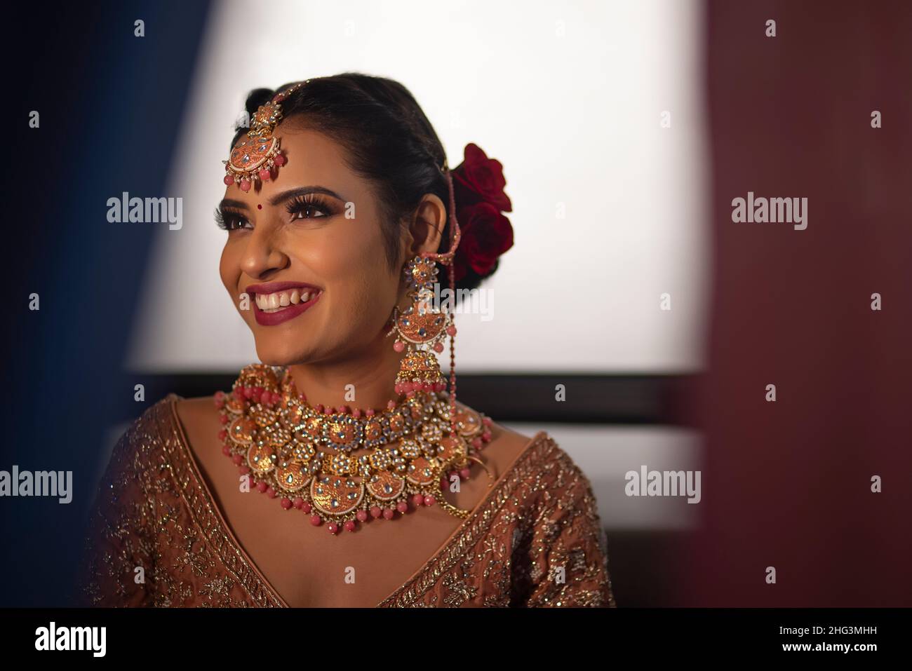 Beautiful Indian bride in traditional wedding outfit smiling Stock ...