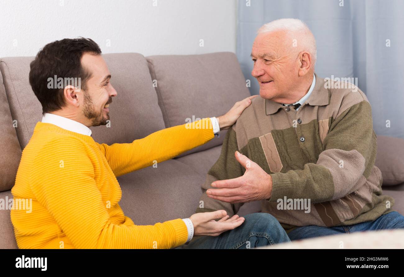 Old father and son friendly conversation Stock Photo - Alamy