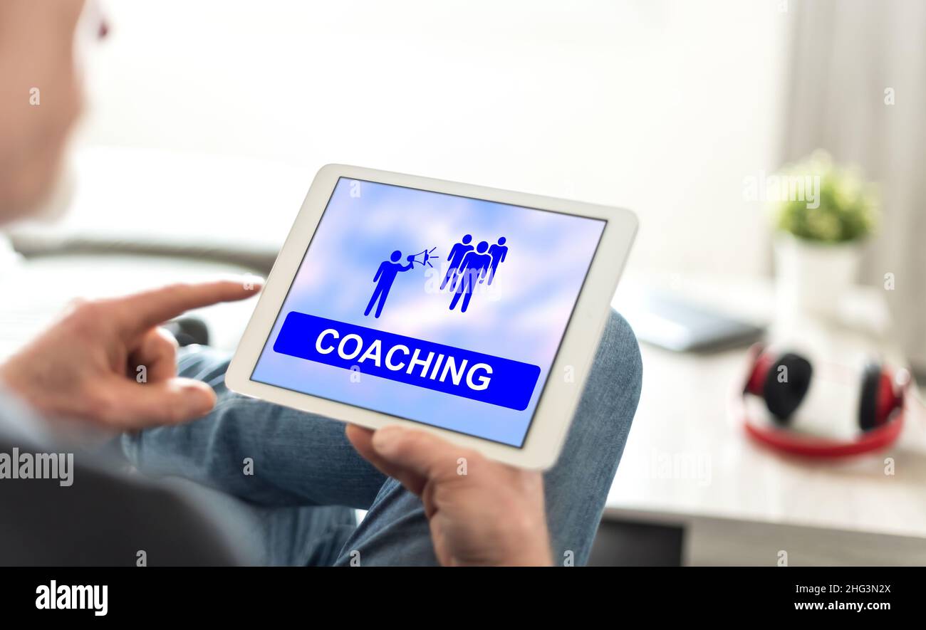 Tablet screen displaying a coaching concept Stock Photo - Alamy