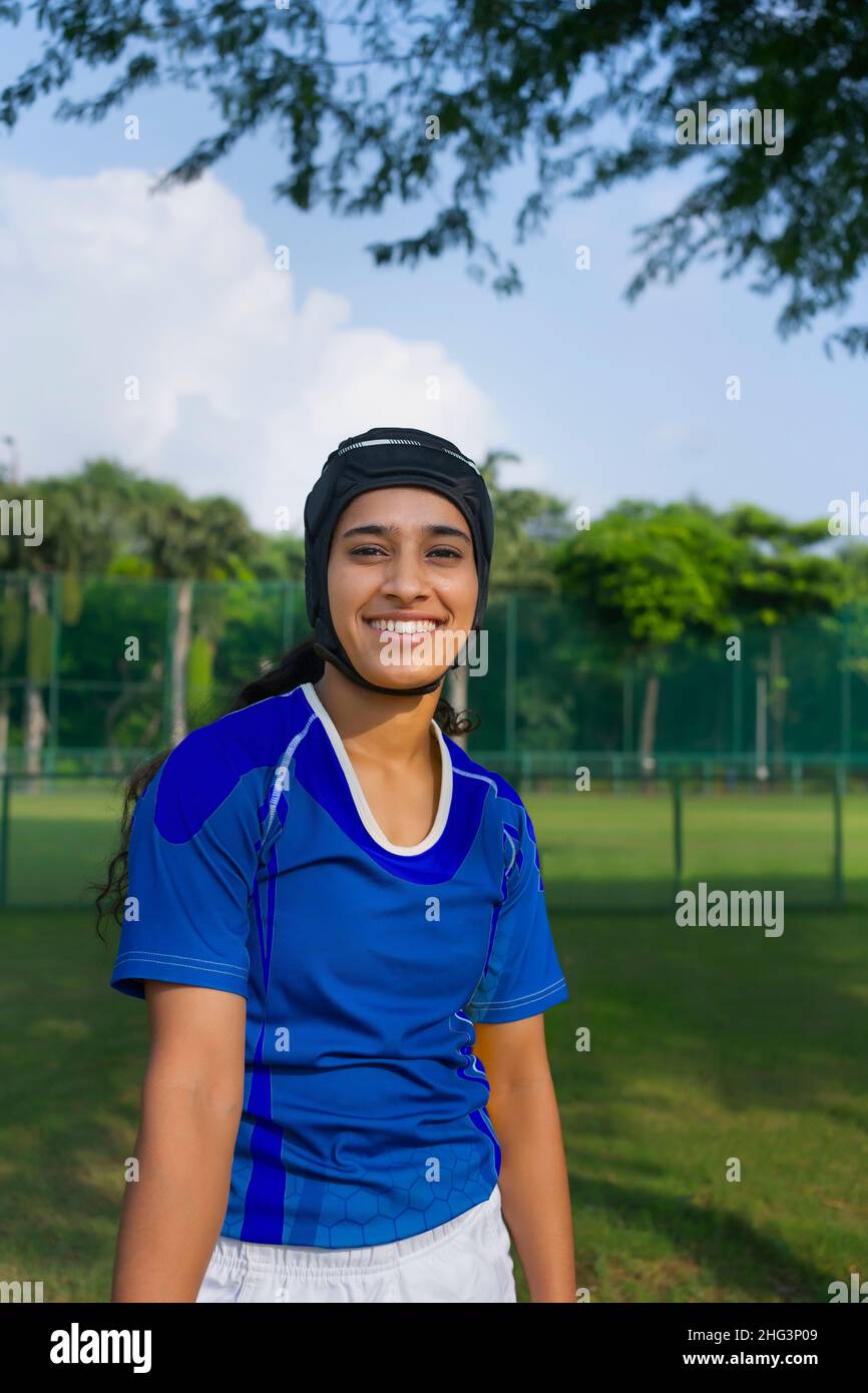 Young rugby player posing in front of camera with smiling face on the ...