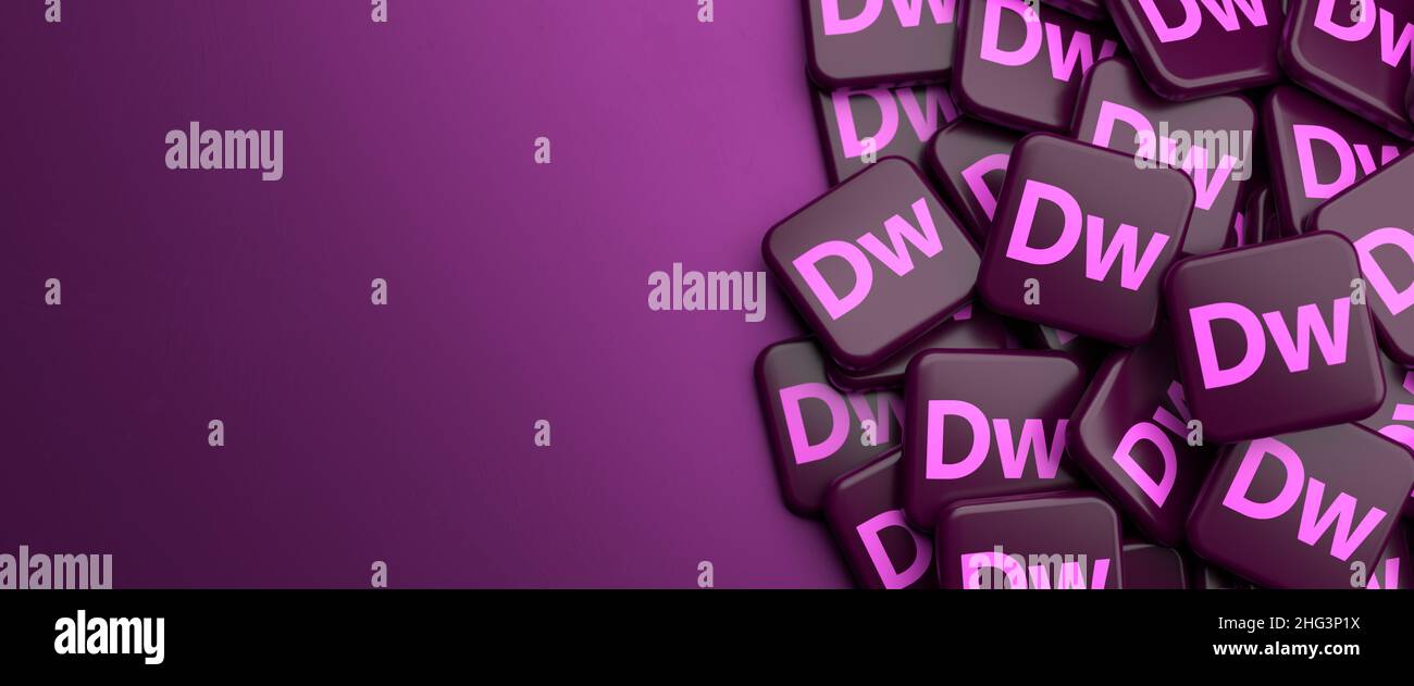 Logos of the web development and editing tool Adobe Dreamweaver on a heap on a table. Copy space ...