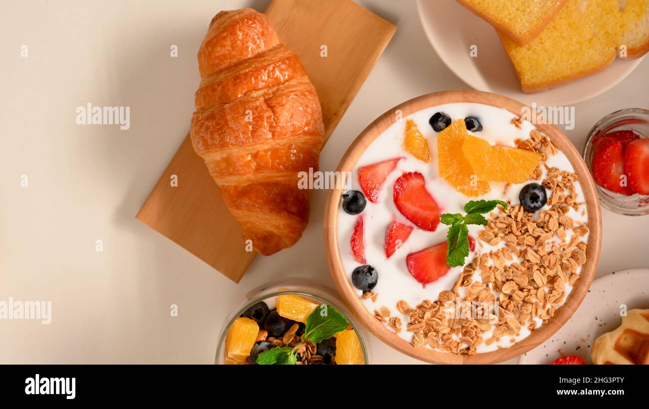 Top view of a yummy healthy breakfast set with homemade granola yogurt ...