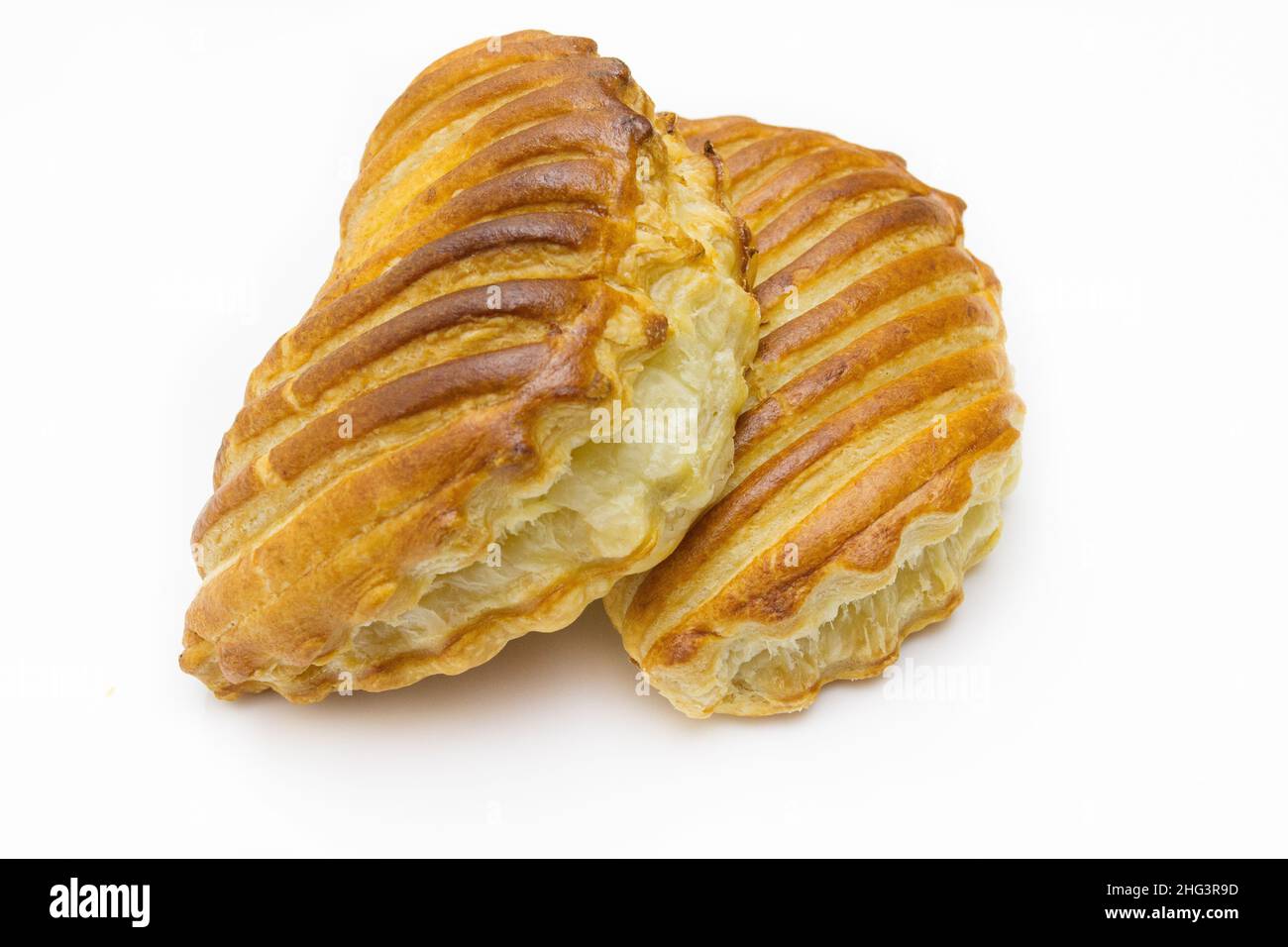 two apple turnovers on a white background Stock Photo - Alamy