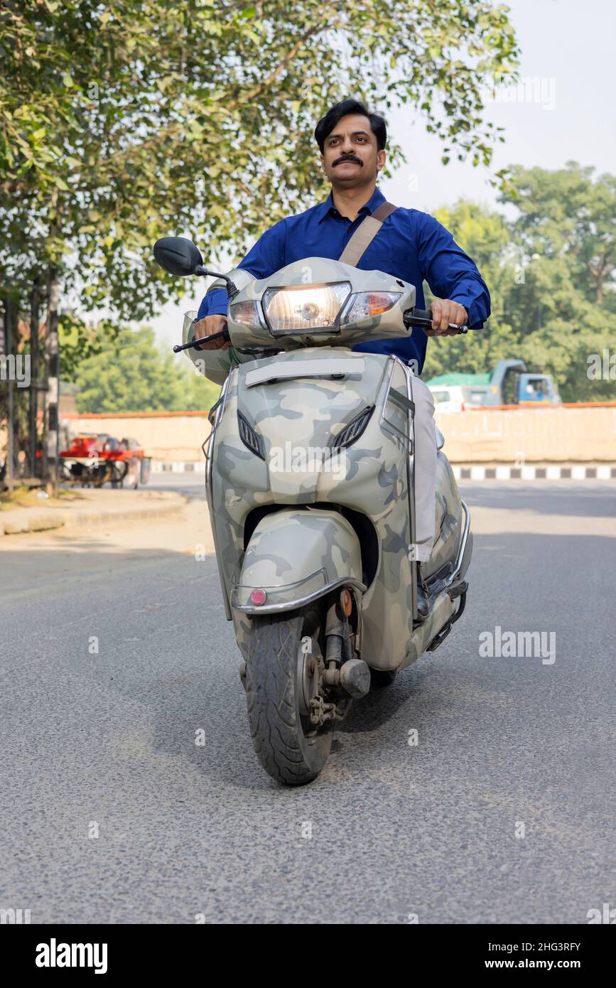 Indian Man Riding A Scooter High Resolution Stock Photography and ...