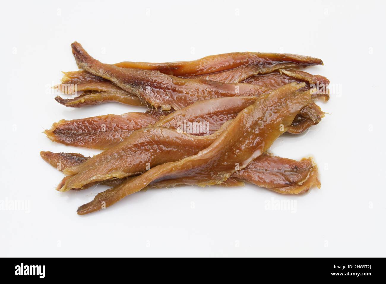 anchovy in oil on a white background Stock Photo - Alamy