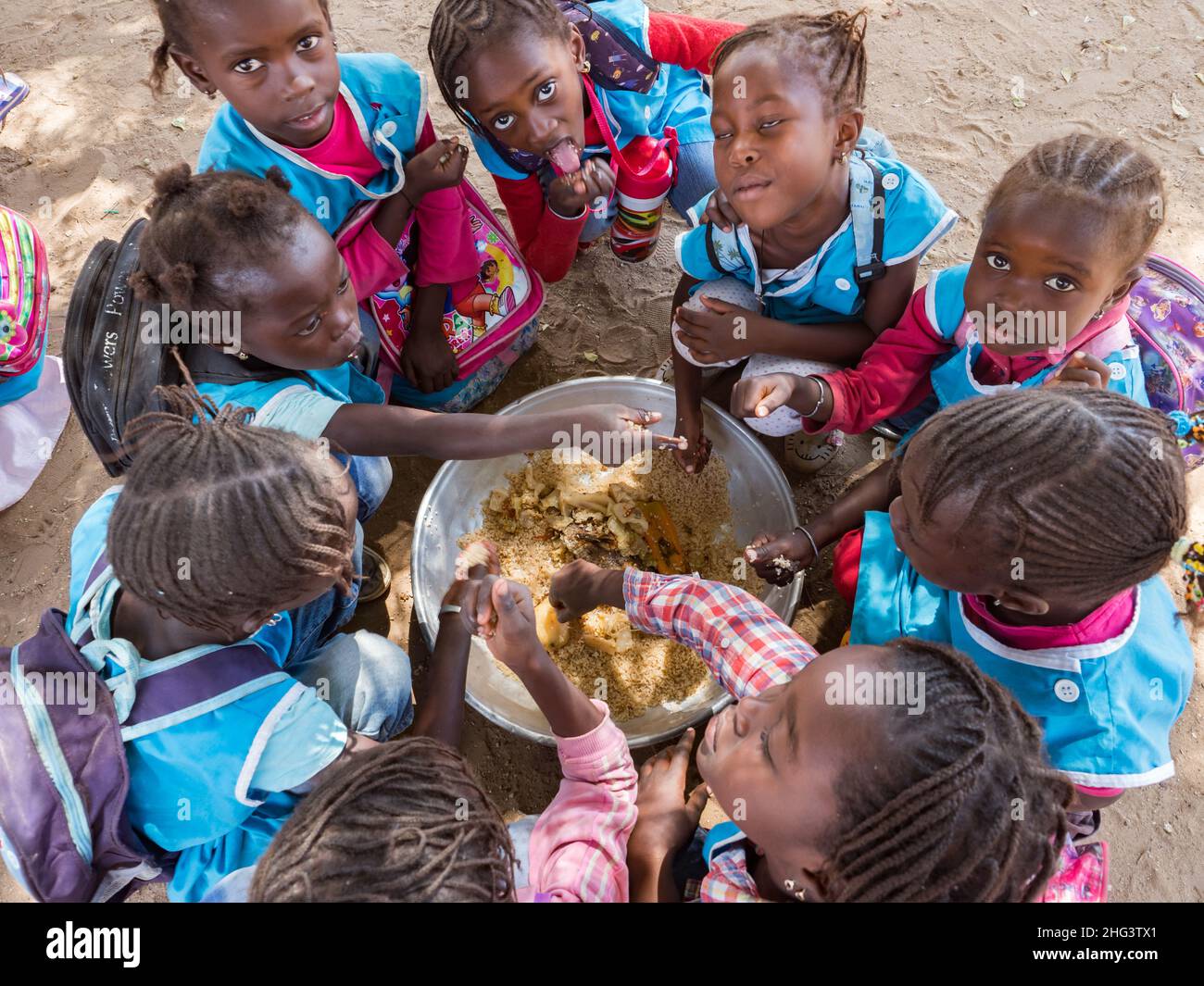 Senegal, Africa - Jan 2019: Senegalese children eat at school together ...